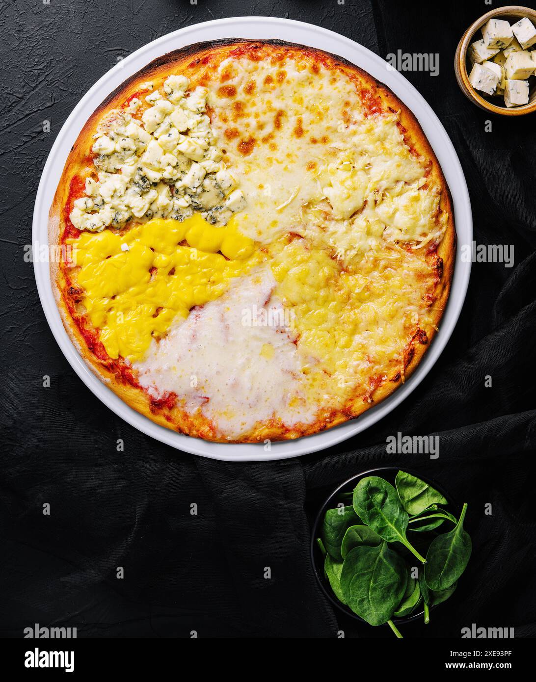 Different types of cheese on a big pizza hi-res stock photography and ...