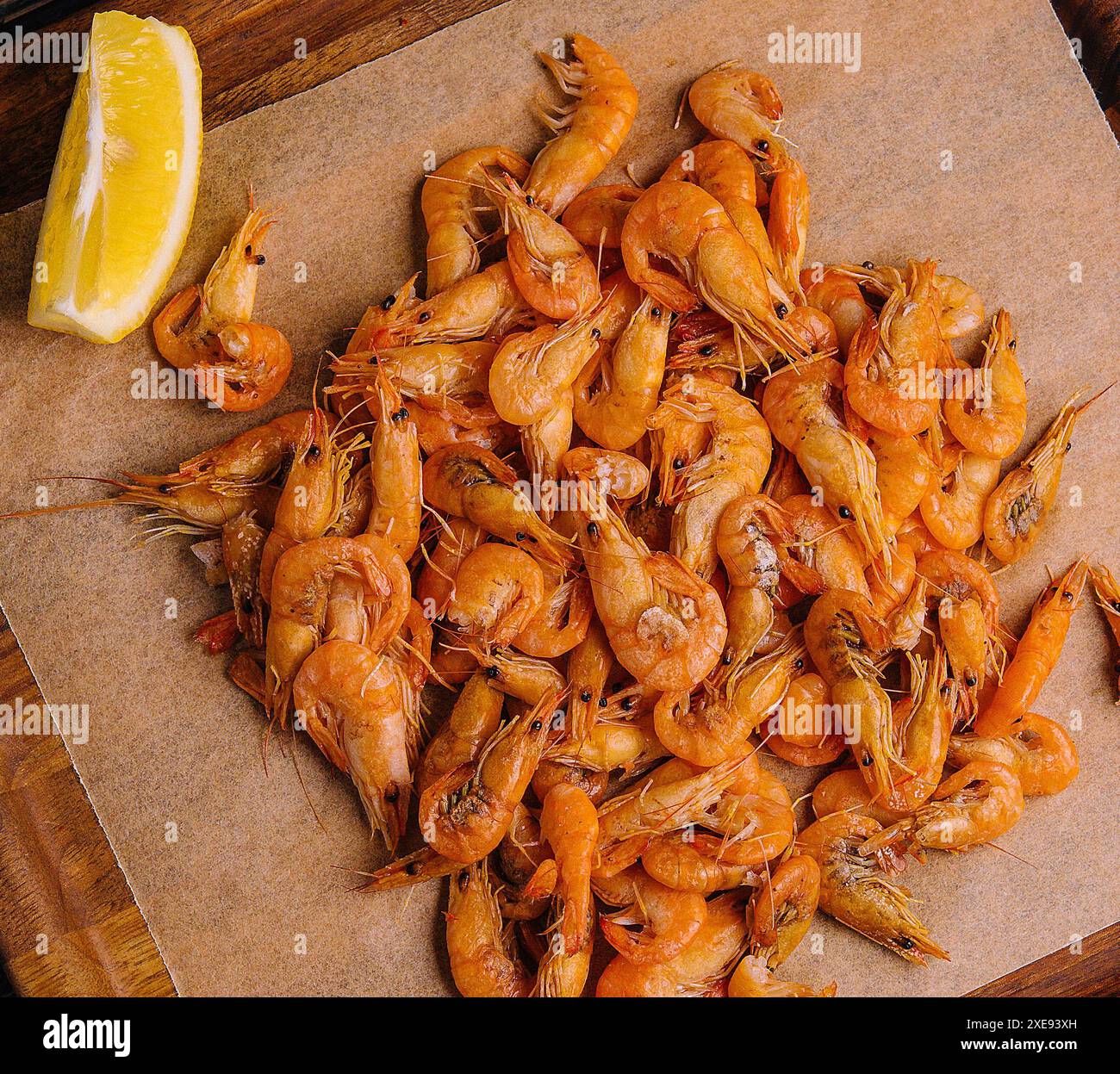 Small cooked shrimp on wooden tray Stock Photo - Alamy