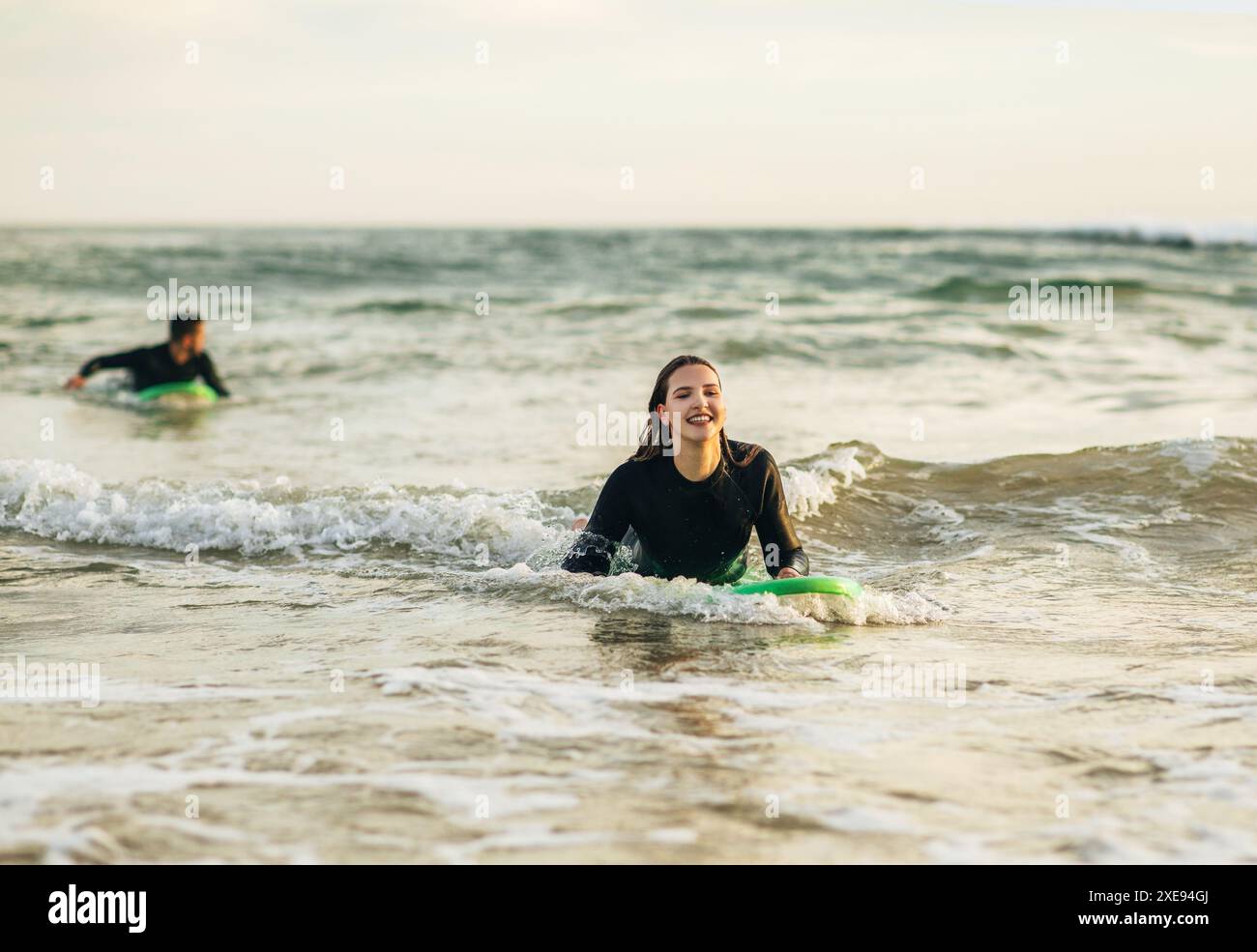 Young female bodyboarding hi-res stock photography and images - Alamy