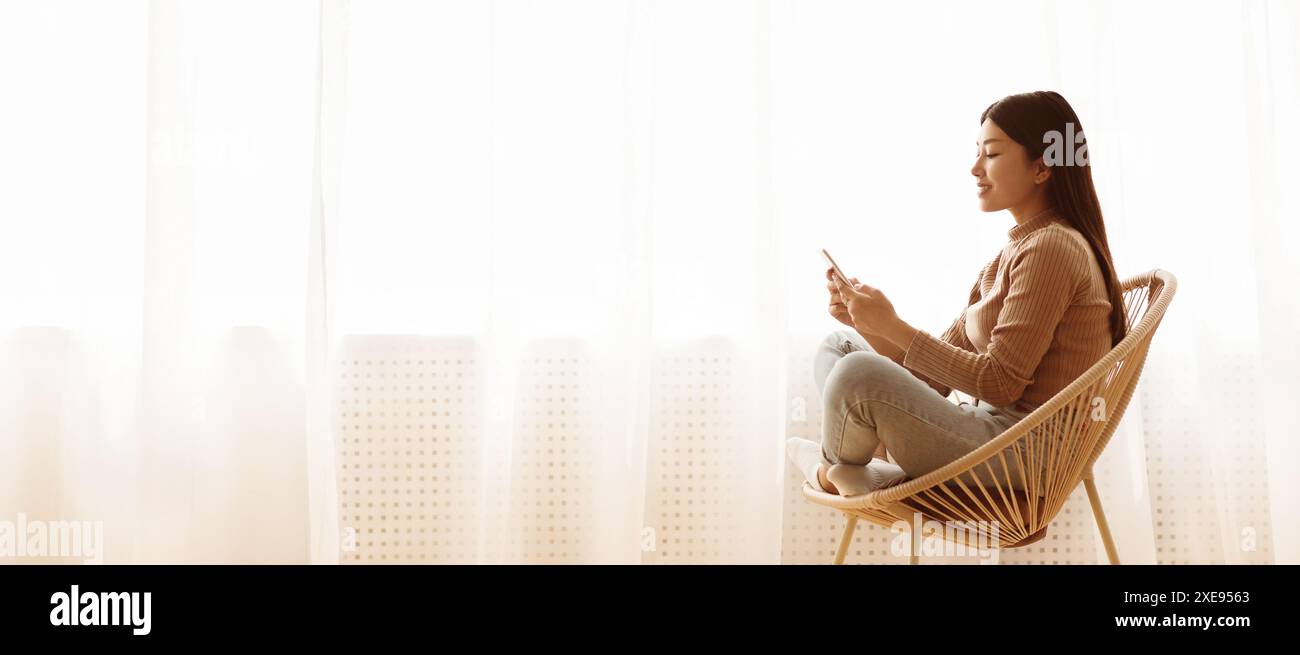 Sitting window woman using hi-res stock photography and images - Alamy