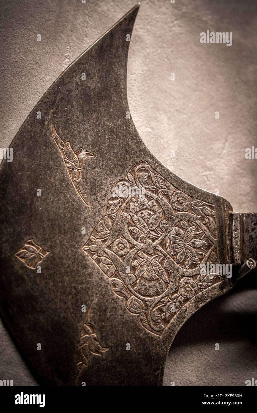 Ax with flower engraving Stock Photo - Alamy