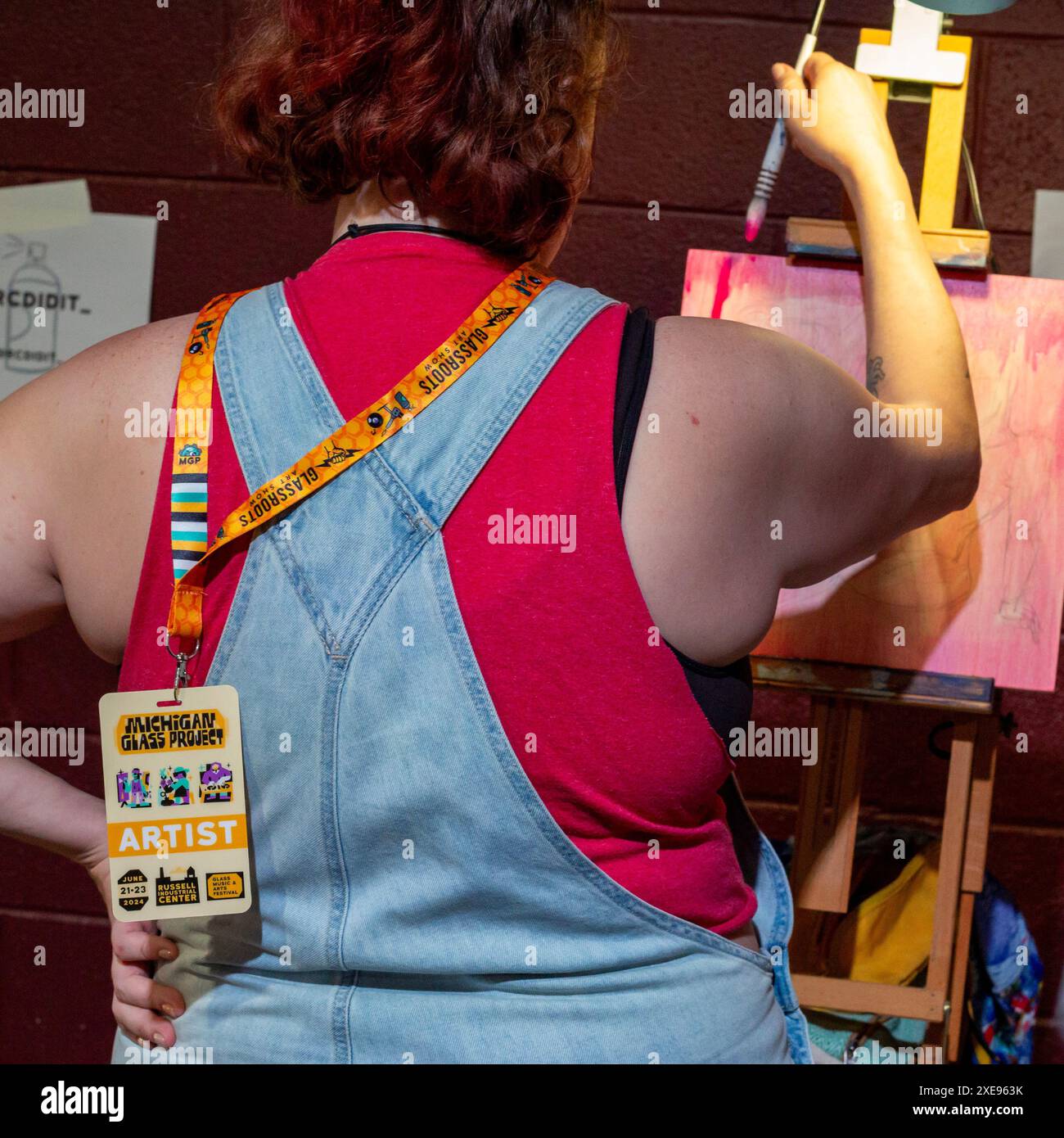 Detroit, Michigan - An artist creates a painting at the Michigan Glass ...