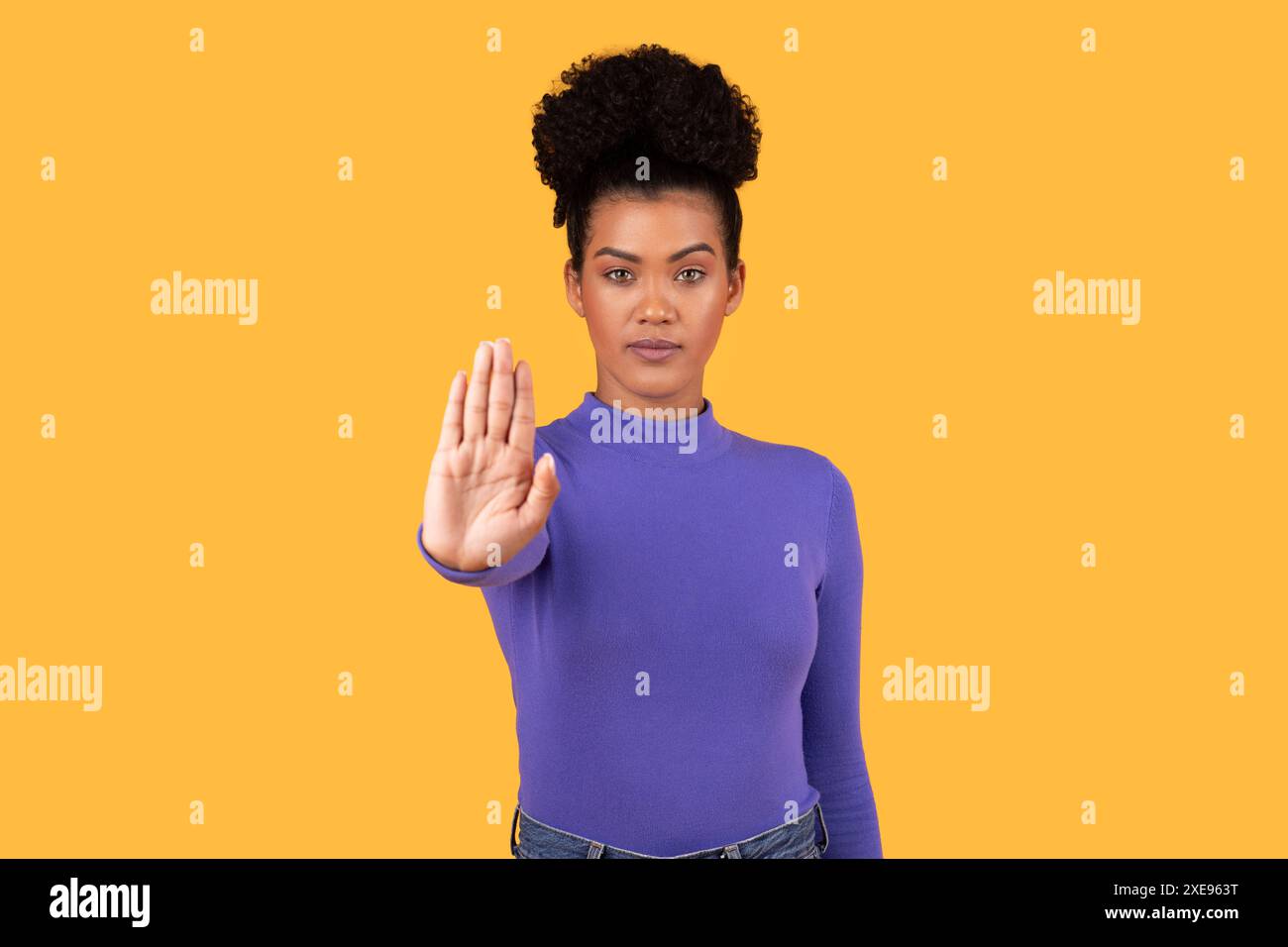 Woman holding hand stop hi-res stock photography and images - Alamy