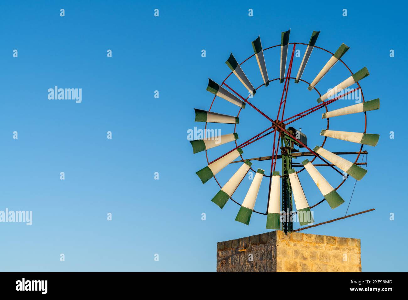 A close-up view of a modern windmill with steel blades in the interior ...