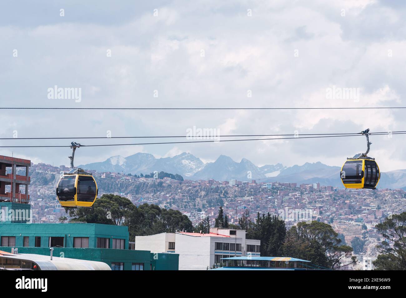 yellow cable car means of transport with a view of the city of bolivia ...