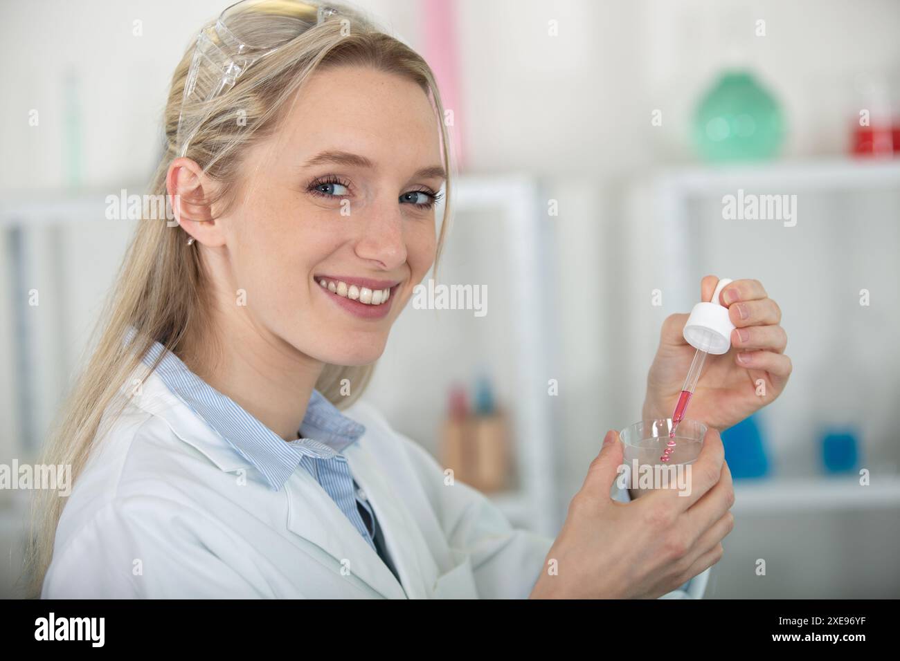 Researcher dropping reagent chemical liquid hi-res stock photography ...