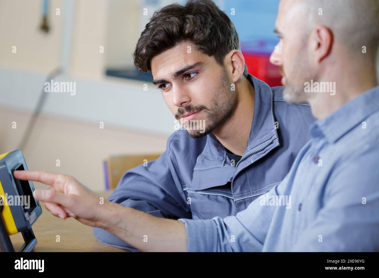 engineer hand using device in industry Stock Photo - Alamy