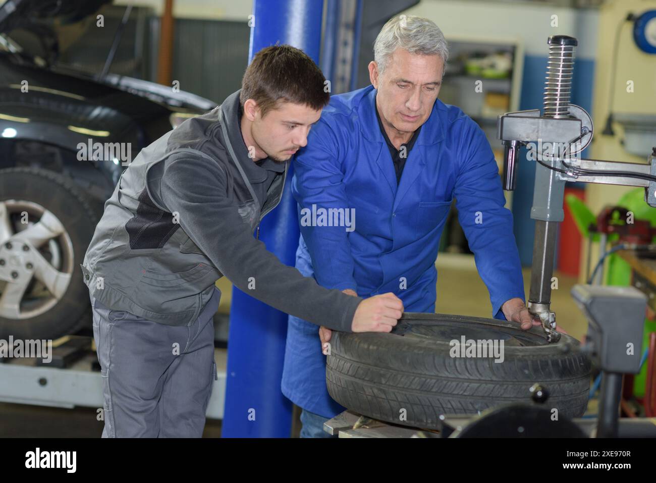student in mechanics working on car engine Stock Photo - Alamy