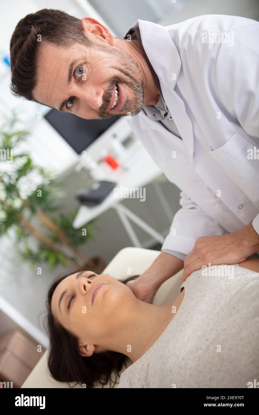female patient receiving osteopathic neck treatment Stock Photo - Alamy