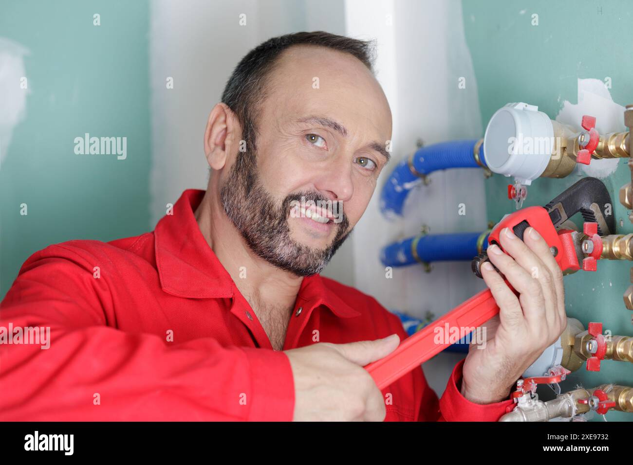 plumber at work installing a water meter Stock Photo - Alamy