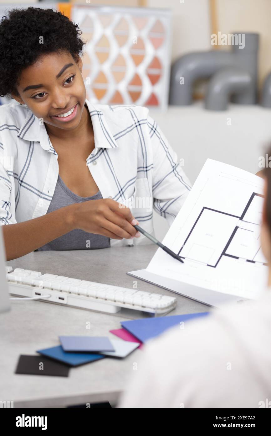 commercial architect showing engineering drawings Stock Photo - Alamy