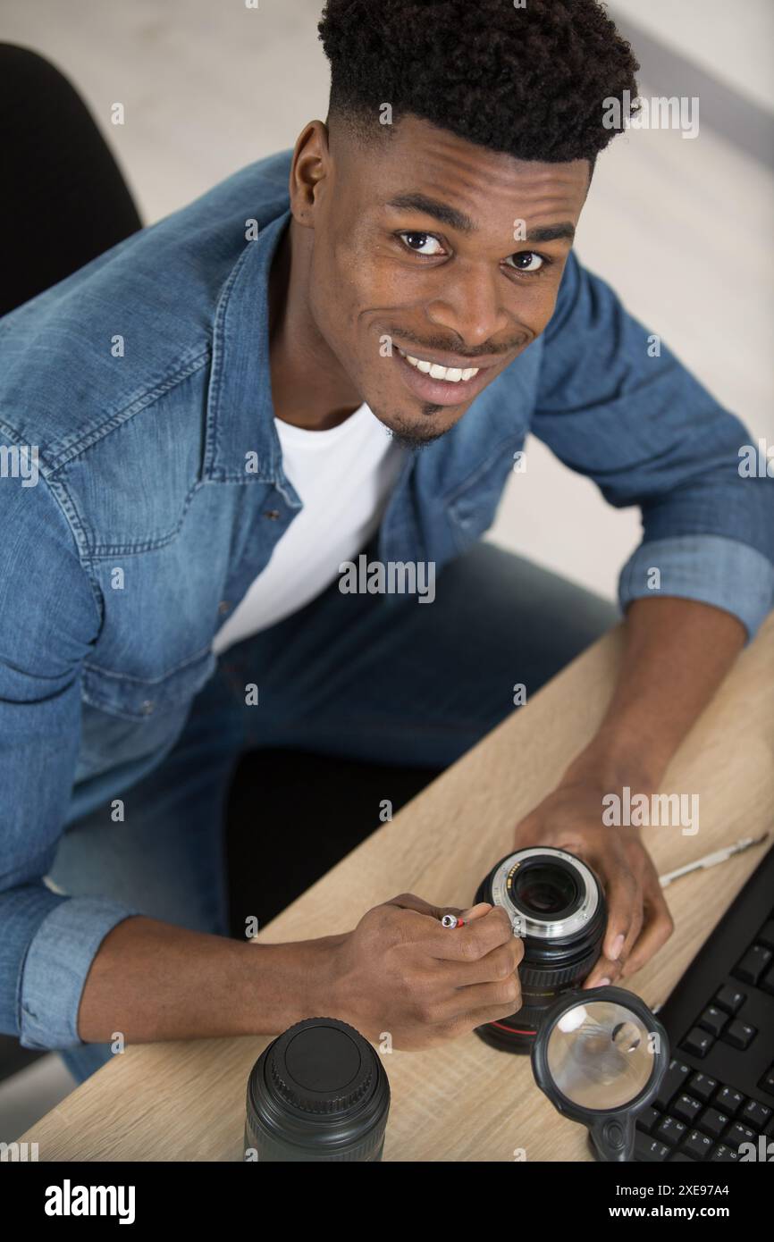 a man is cleaning the lens Stock Photo - Alamy
