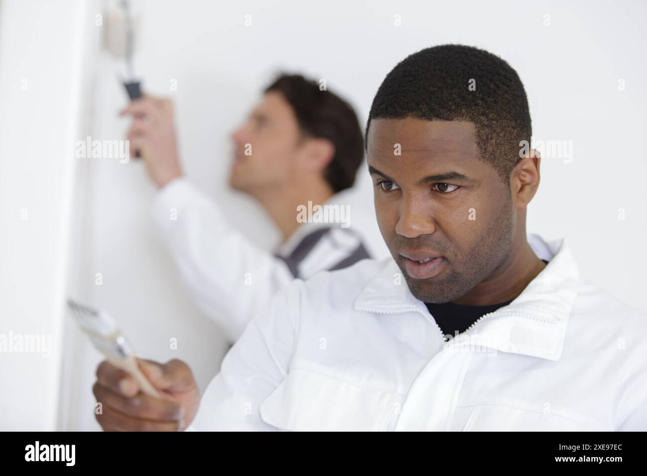 two house painters at work Stock Photo - Alamy