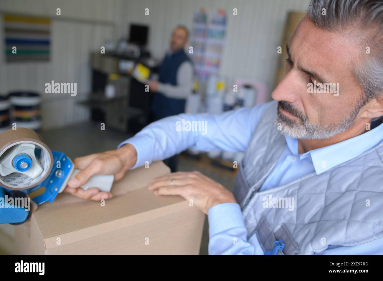 close-up view of cardboard box in mover hands Stock Photo - Alamy