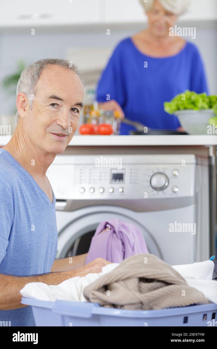 a senior man doing laundry Stock Photo - Alamy
