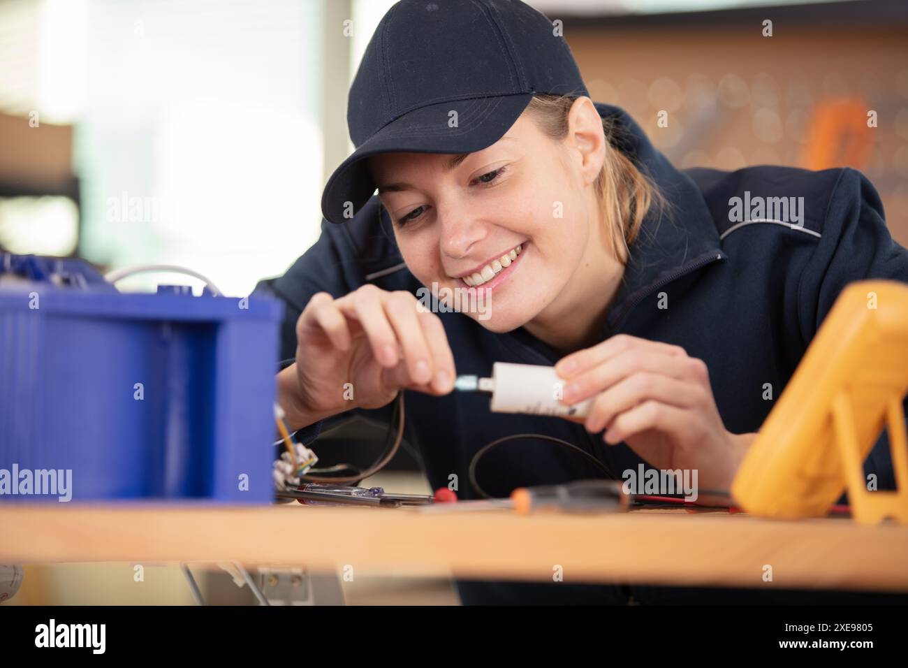 female technician connecting cables into ventilation unit Stock Photo ... female technician connecting cables into ventilation unit Stock Photo ...