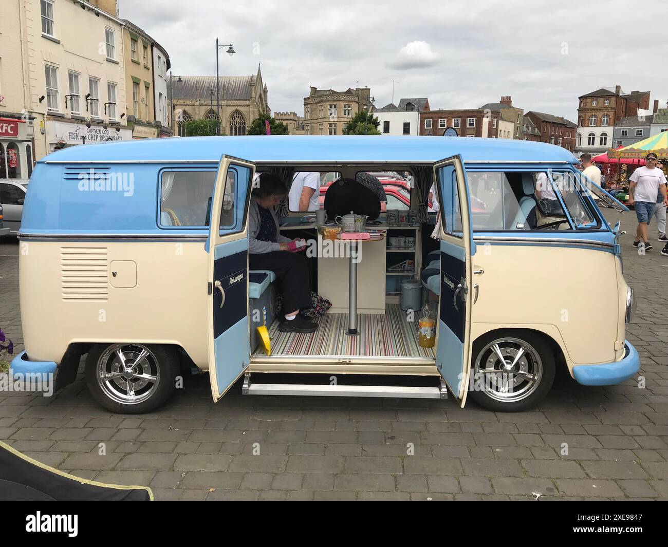 looking inside a Volkswagen Westfalia Camper van at a classic car show ...