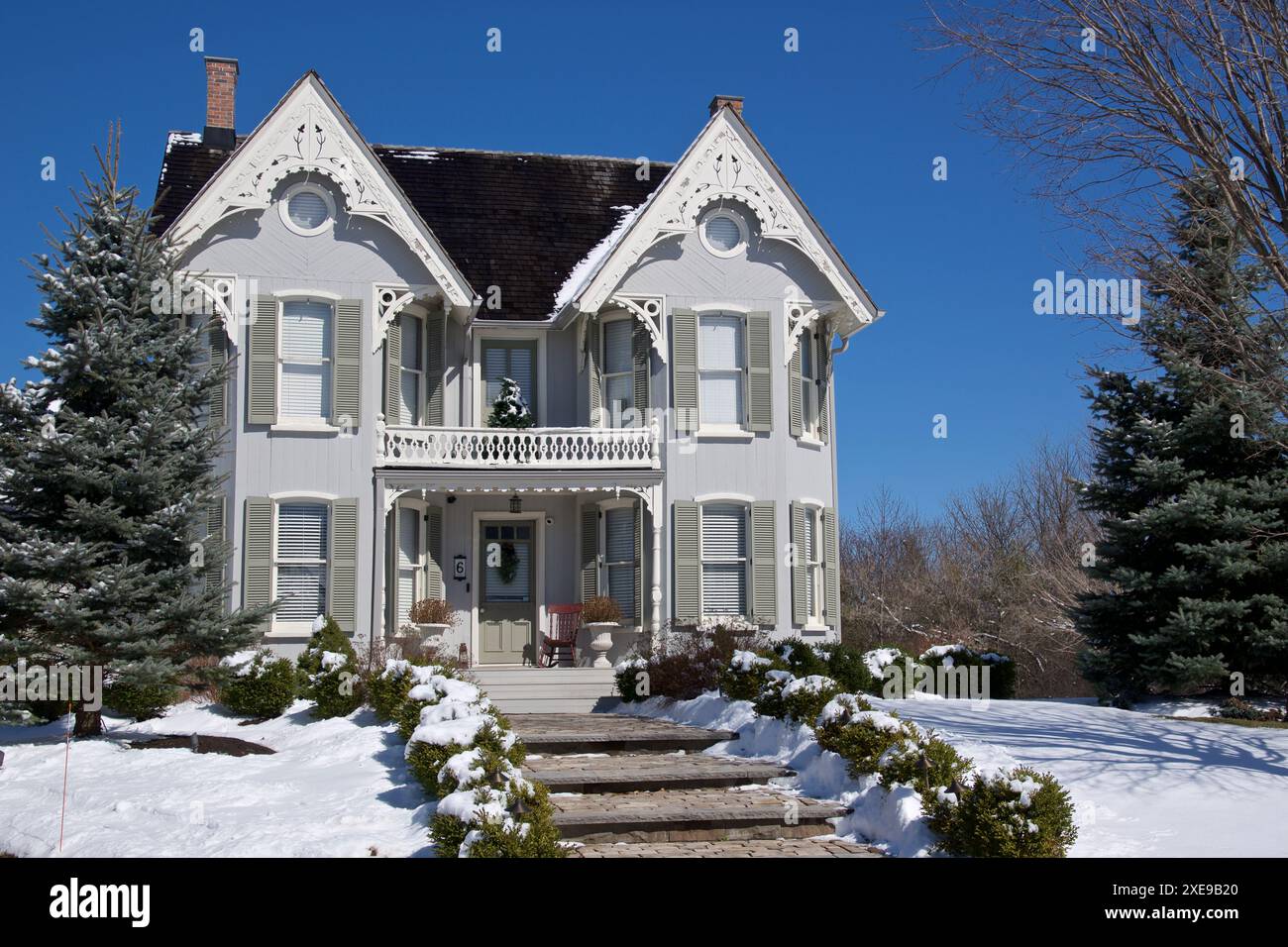 View of the Victorian style house with deep snow in winter Stock Photo ...