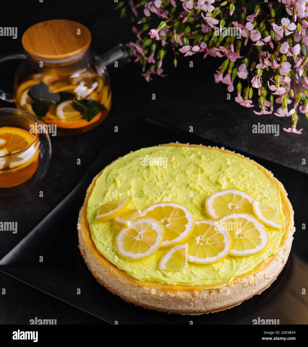 Layered Lemon Cheesecake on black plate Stock Photo - Alamy