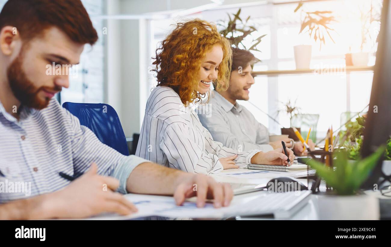 Young woman journalist working in public coworking space Stock Photo ...