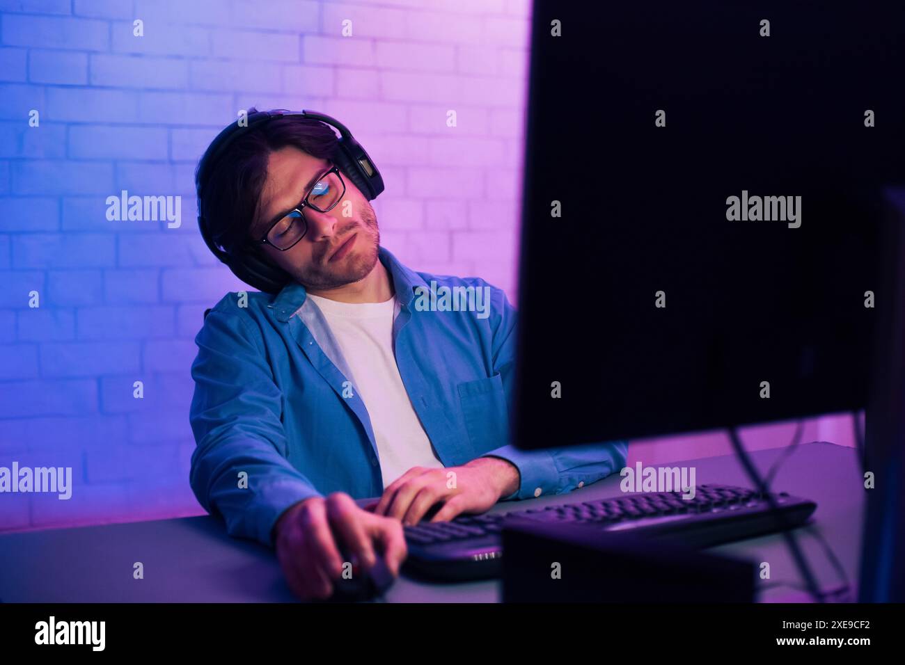 Tired Gamer Working Late at Night in Front of Computer Stock Photo - Alamy