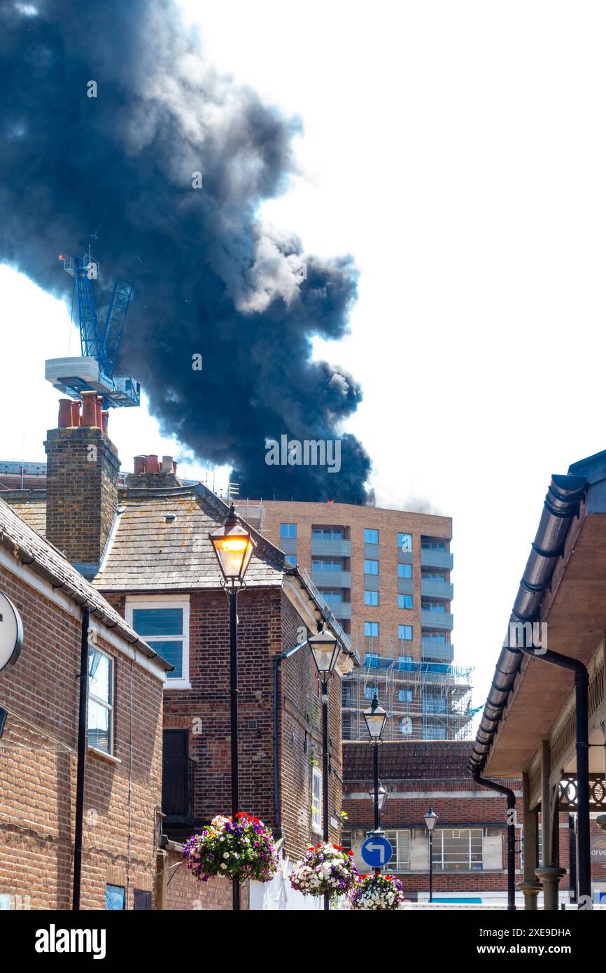 Staines, UK. 26th June. A fire has broken out in Staines central above a tower block. A massive ...