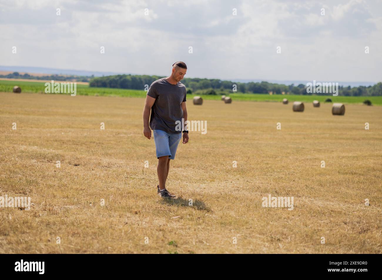 Man walks through meadow hi-res stock photography and images - Alamy