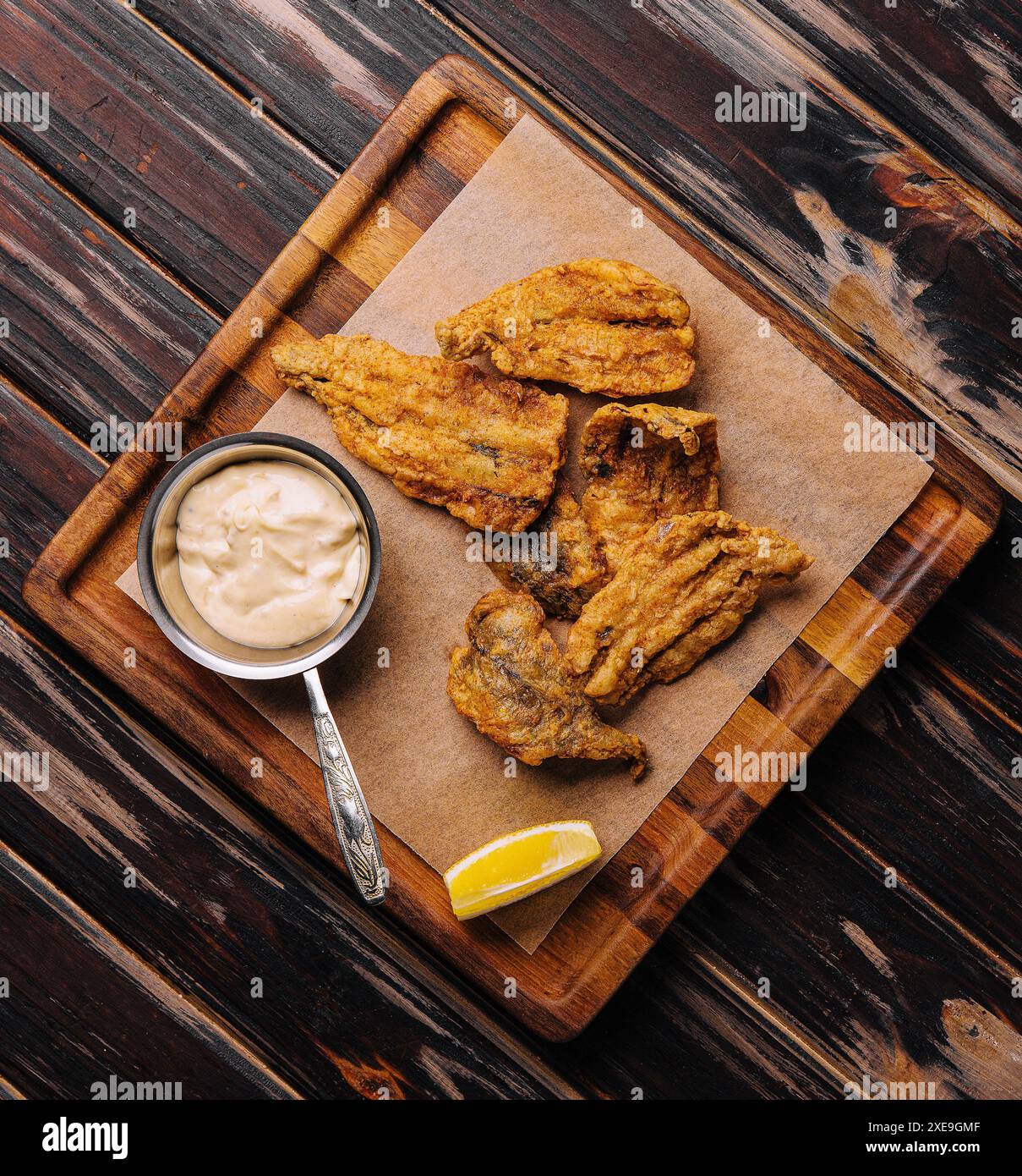 Fried cod fillet pieces on wooden tray Stock Photo - Alamy