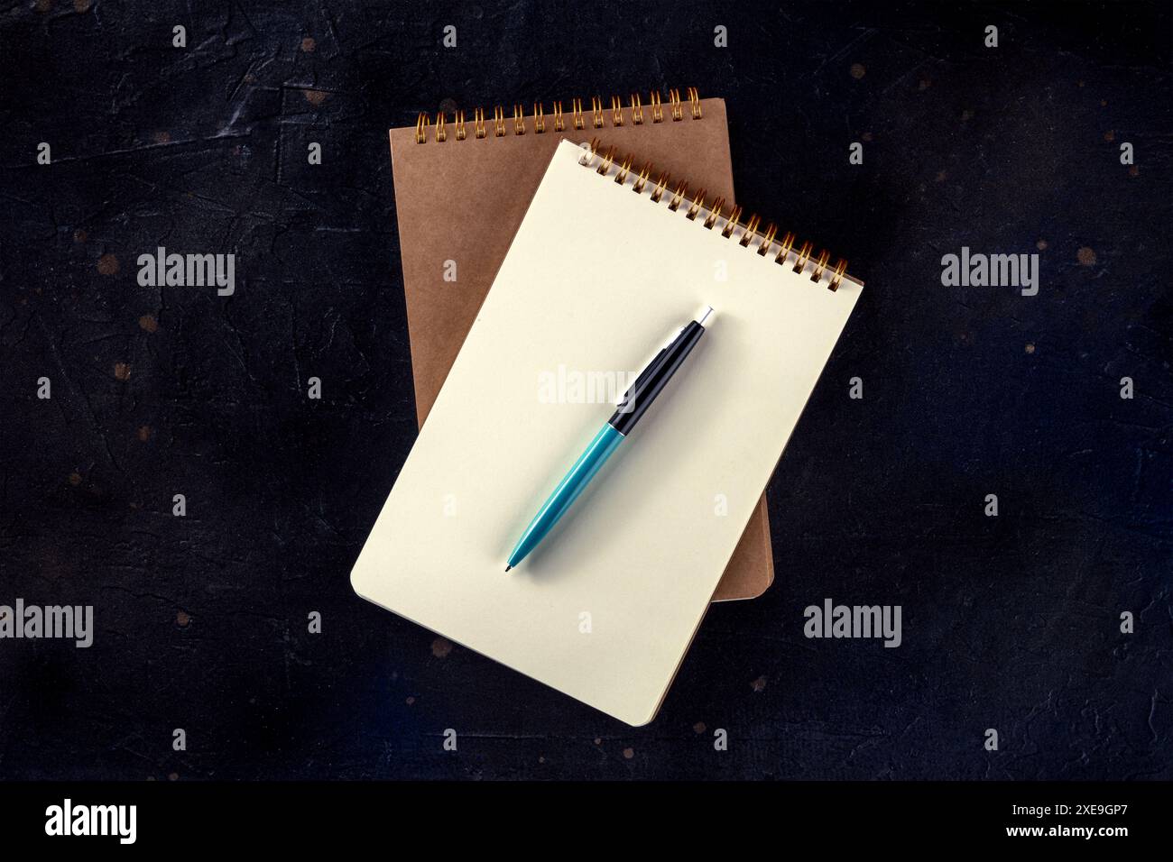 Notebook mockup with a pen, overhead flat lay shot on black Stock Photo ...
