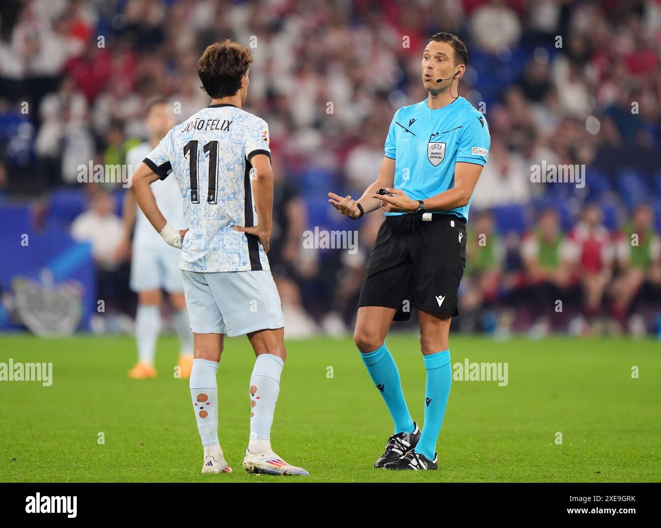 Referee Sandro Schärer speaks to Portugal's Joao Felix during the UEFA ...