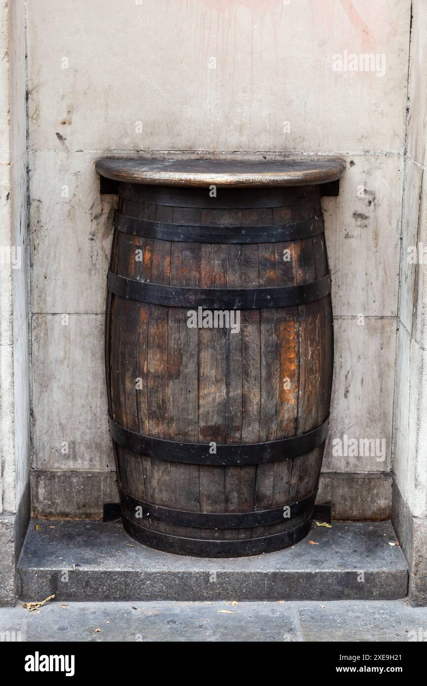 Bar table in shape of half barrel mounted in wall, retro interior ...