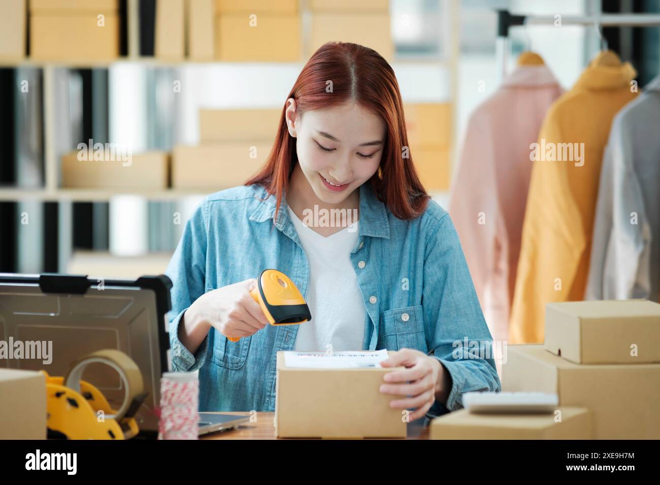 Scanning Barcode on Shipping Box with Scanner Stock Photo - Alamy