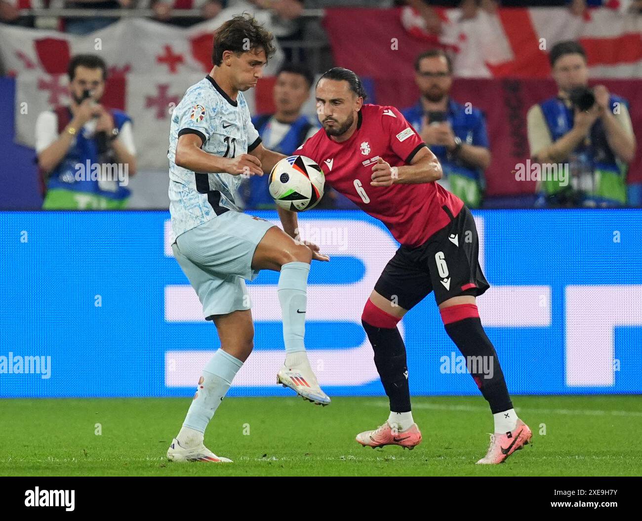 Portugal's Joao Felix (left) and Georgia's Giorgi Kochorashvili battle ...