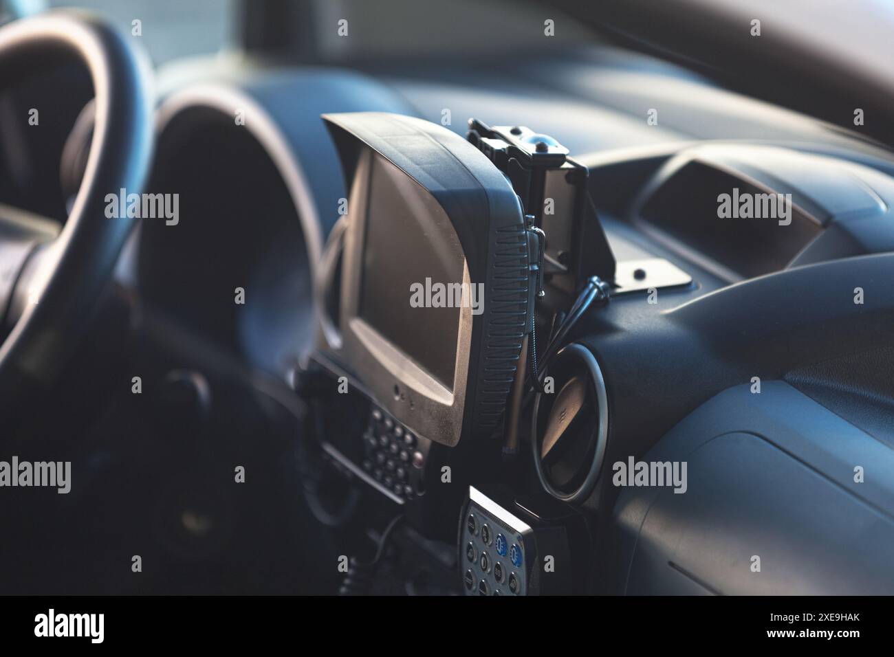 Focus on the radio, control panel and computer screen inside of a ...