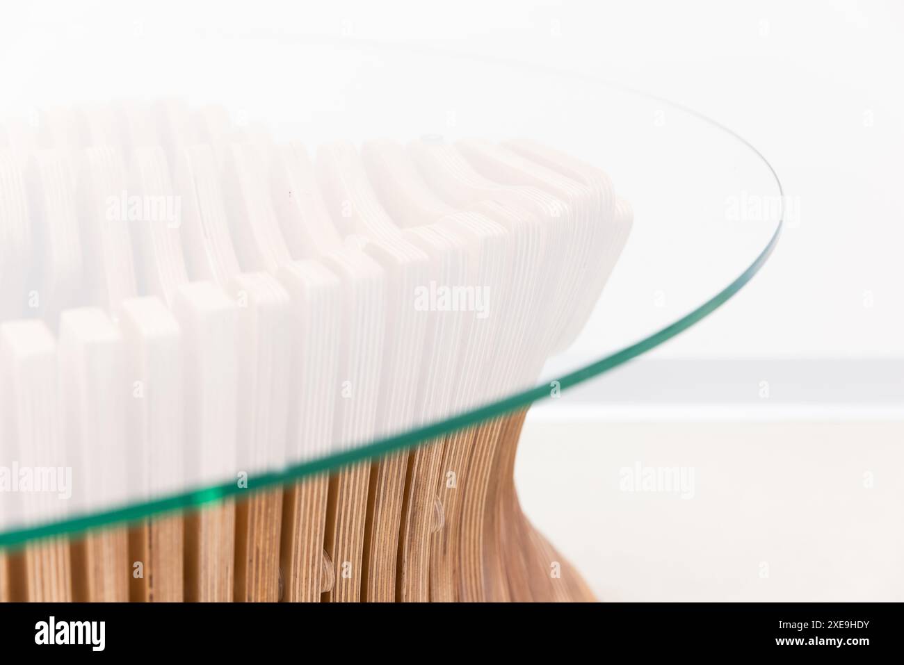 Abstract modern interior design details, round glass table with a base ...