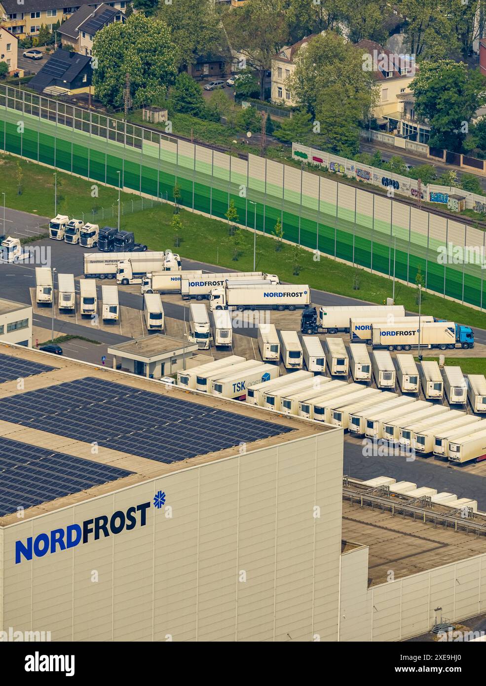 Aerial photo, Nordfrost GmbH, noise barrier on the railroad line, truck ...