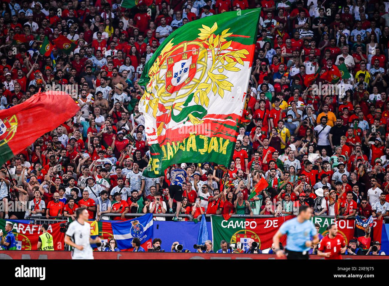 GELSENKIRCHEN, GERMANY - JUNE 26: Fans of Portugal waving flag during ...