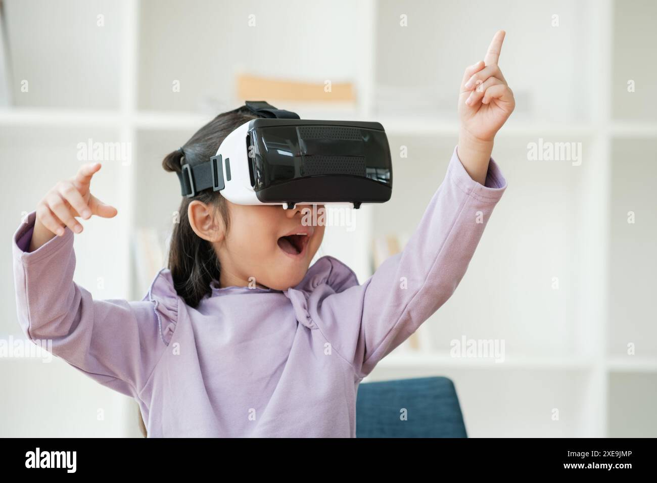 Child Delighted by Virtual Reality Experience Stock Photo - Alamy