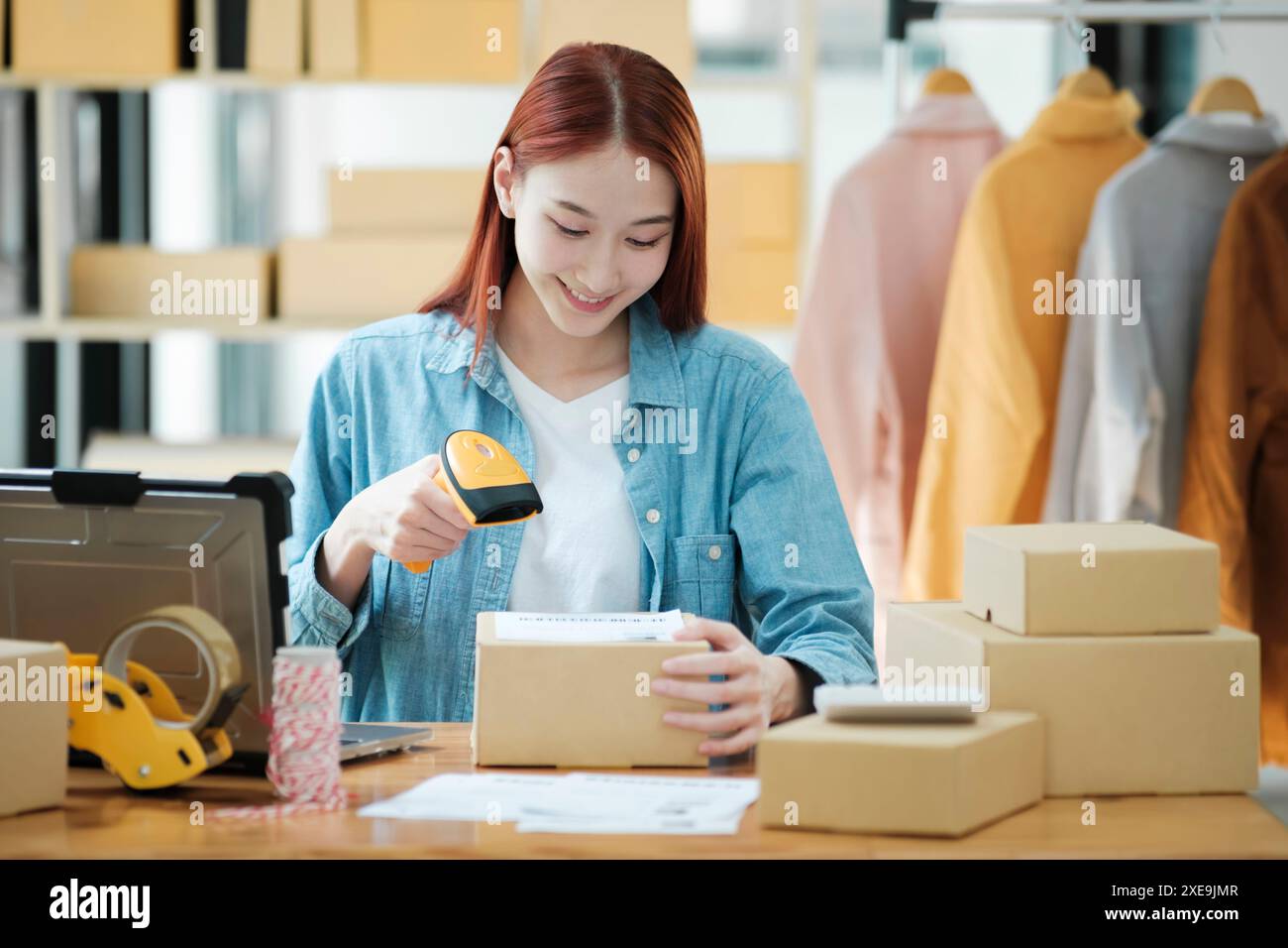 Scanning Barcode on Shipping Box with Scanner Stock Photo - Alamy