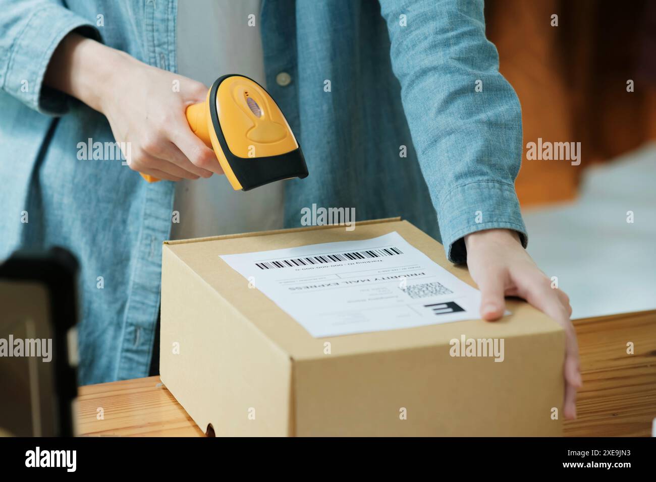 Scanning Barcode on Shipping Box with Scanner Stock Photo - Alamy