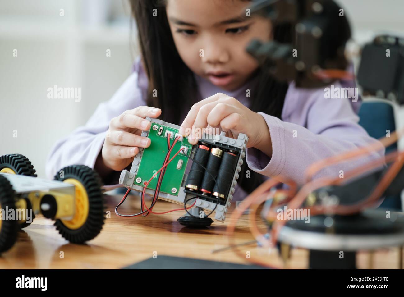 STEM education concept. Asian young girl learning robot design Stock ...