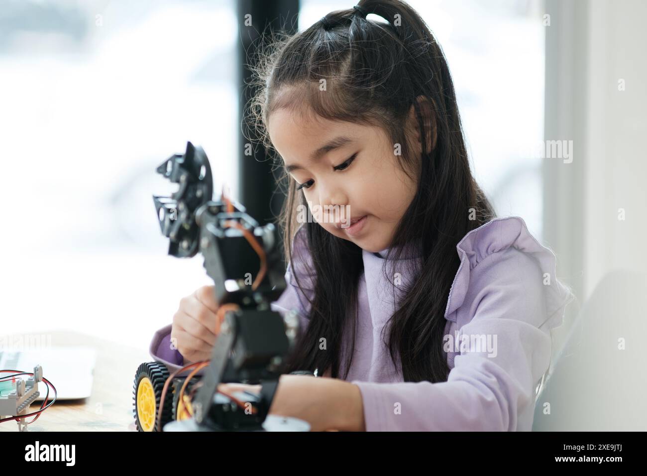 STEM education concept. Asian young girl learning robot design Stock ...