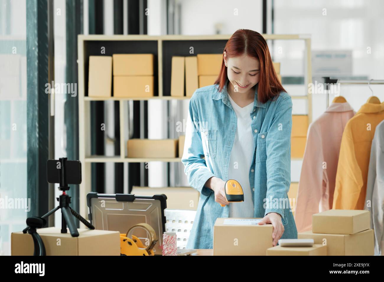 Scanning Barcode on Shipping Box with Scanner Stock Photo - Alamy