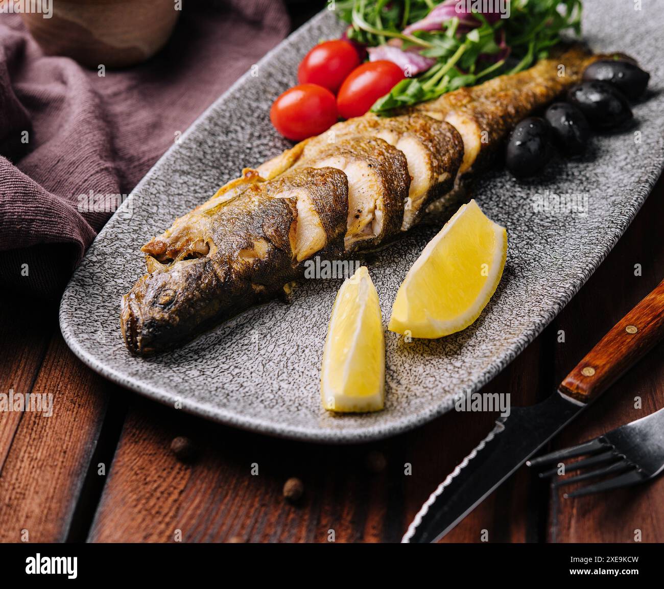 Fish dish - roast trout and vegetables Stock Photo - Alamy