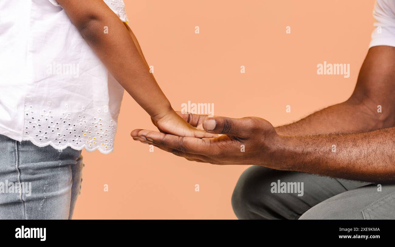 Little Girl Reaching Out to Fathers Open Hand for Support Stock Photo ...