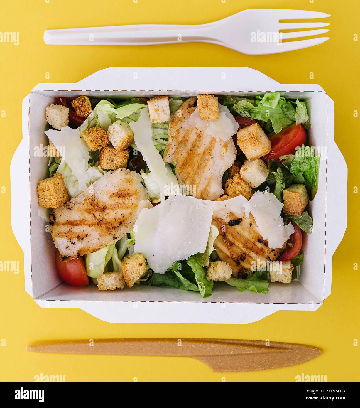 Caesar salad packed on craft box for take away Stock Photo - Alamy