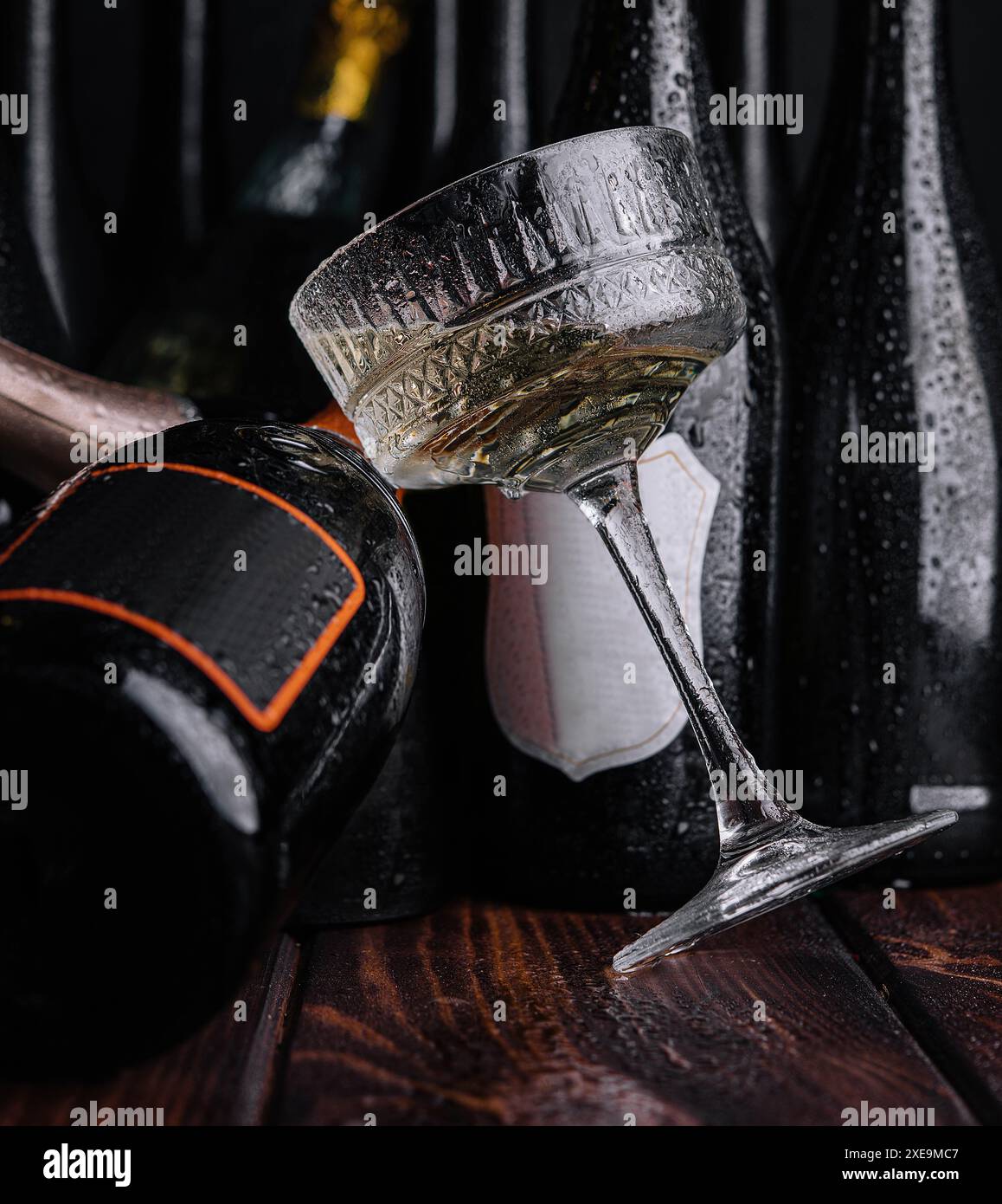 Different bottles of champagne with a glass of white champagne Stock ...