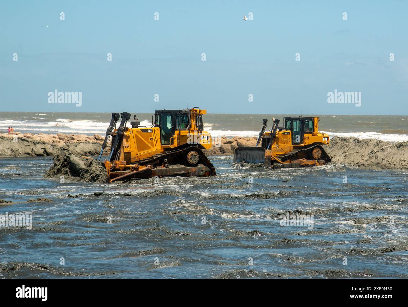 Contractors for the U.S. Army Corps of Engineers Charleston District place material during the ...