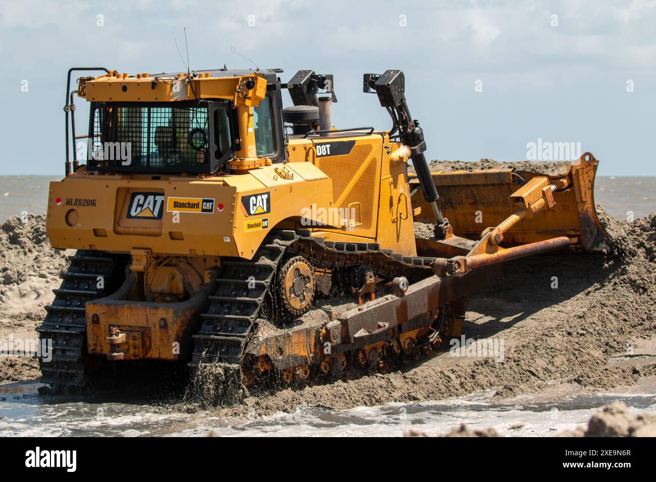 Contractors for the U.S. Army Corps of Engineers Charleston District place material during the ...