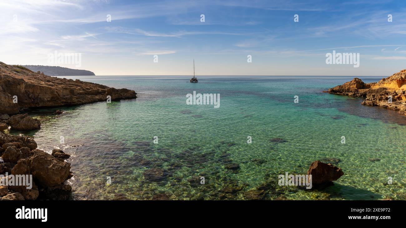 Panorama view of an idyllic cove at Es Cap Enderrocat in southern ...